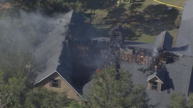 Crews battle raging house fire in Melbourne | WFTV